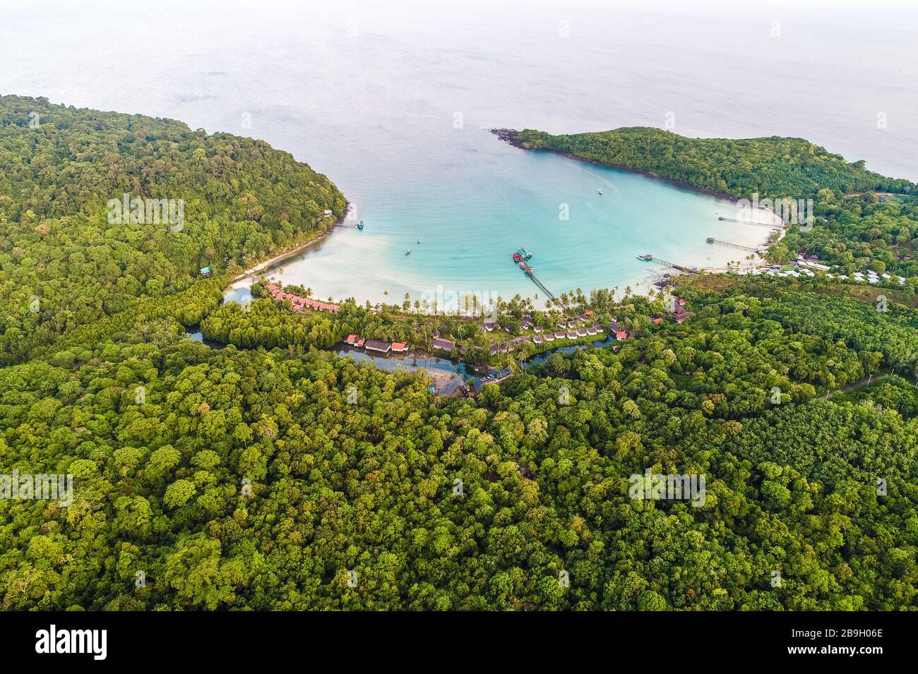 Seashore blue ocean with green tree forest aerial view Stock Photo - Alamy