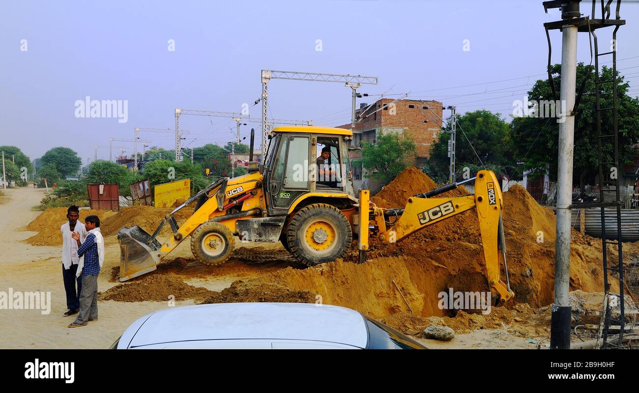 Ranthambhore, India - 9th November 2019:Yellow excavator digging a hole ...