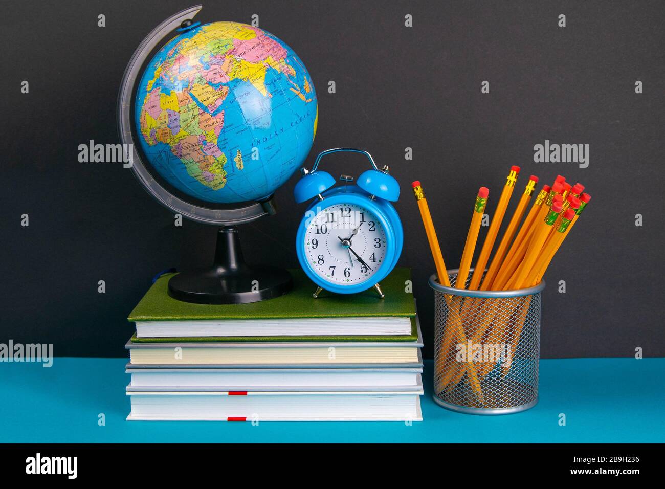 Globe Clock On Books High Resolution Stock Photography and Images - Alamy