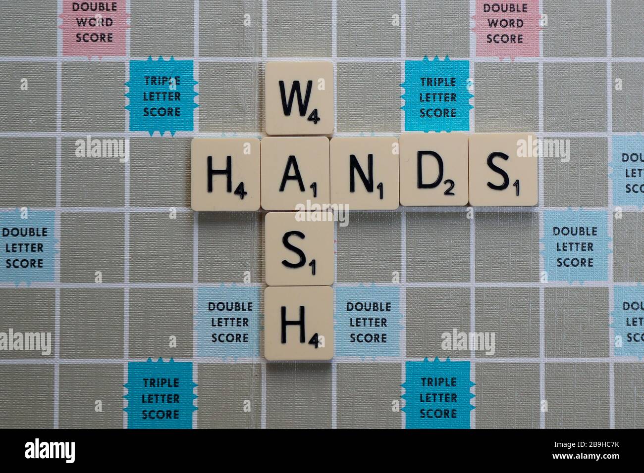 London, UK. 24th March, 2020. Scrabble Board with phrases and words ...