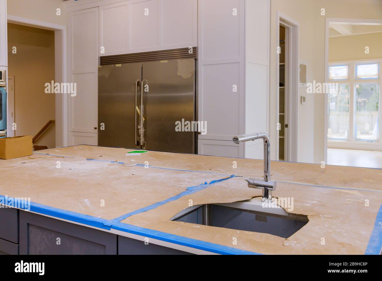Kitchen contemporary with chrome fixture and white conter tops on ...
