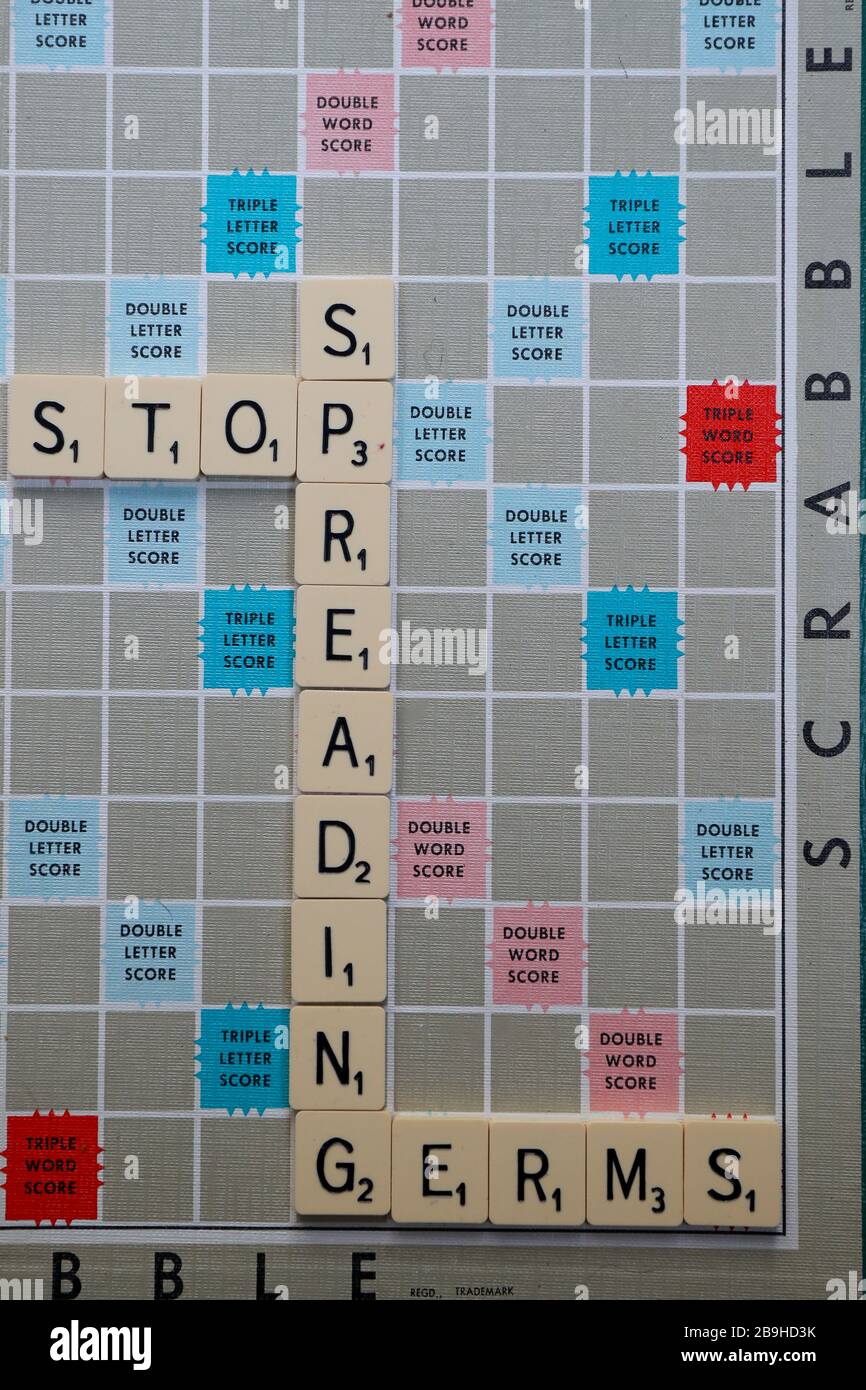 London, UK. 24th March, 2020. Scrabble Board with phrases and words ...