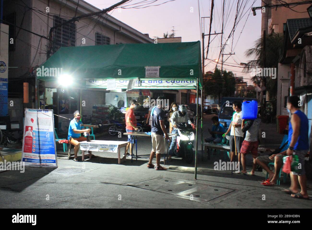 Manila, Philippines. 24th Mar, 2020. Barangay Police guard the borders ...