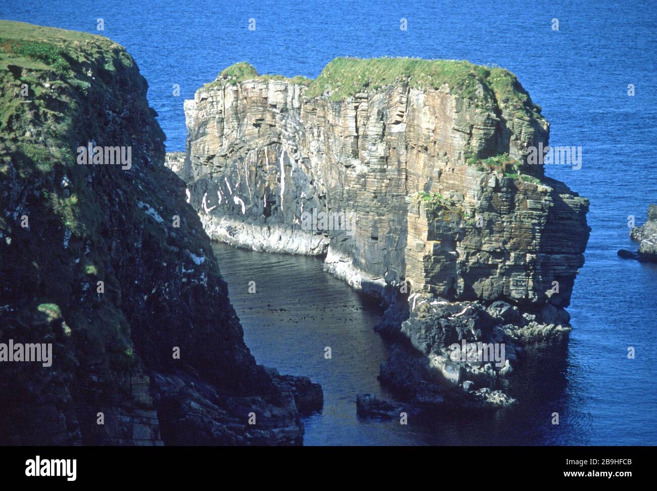 Rocks just off the rugged coast of North County Mayo, Ireland, along ...