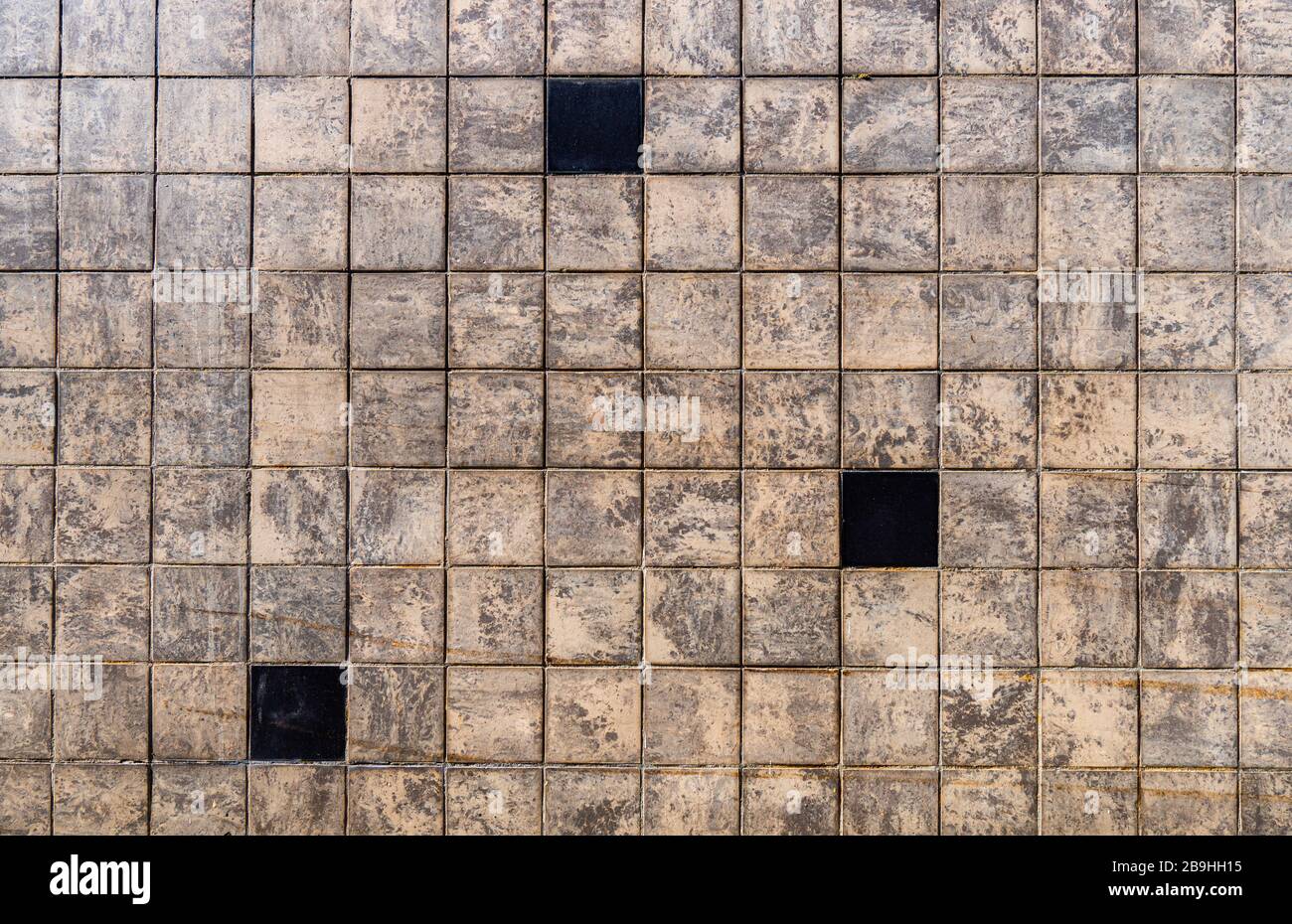 Brown square tiles with black irregularity Stock Photo - Alamy