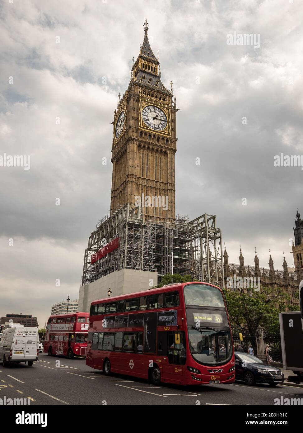 A London bus passing the iconic Big Ben landmark clock tower in ...