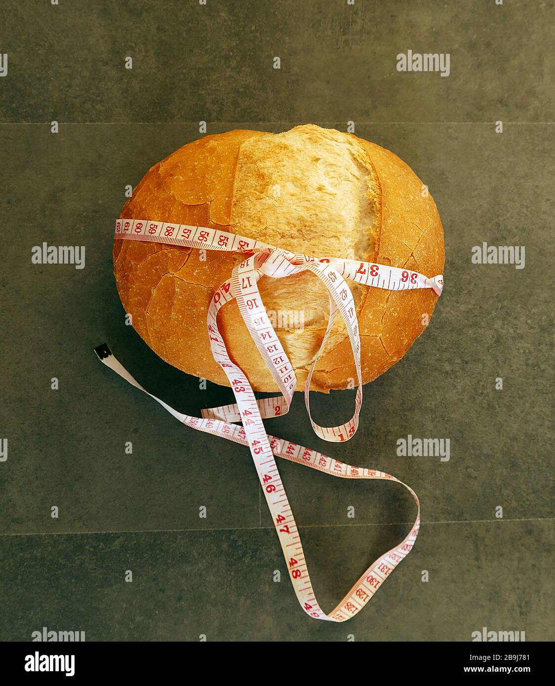 tape measure wrapped in a large bread, bread weighs weight, diet and ...