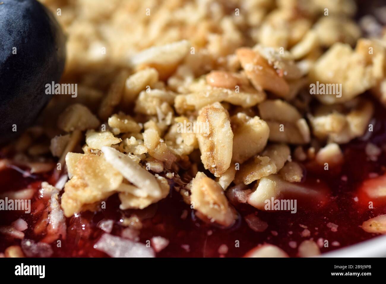Fruit with granola topping Stock Photo - Alamy