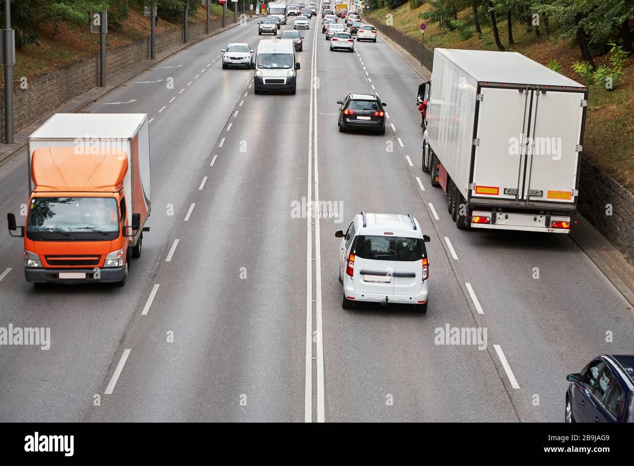 motorway out of city. going cars on the road Stock Photo - Alamy