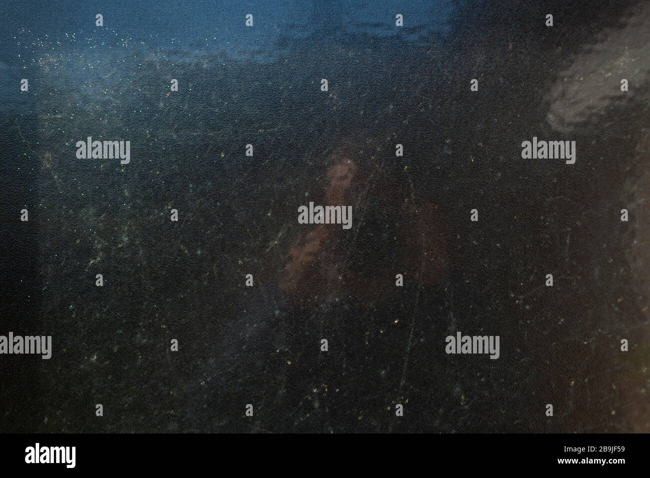 plain glass background illuminated by sunlight and with a slight ...