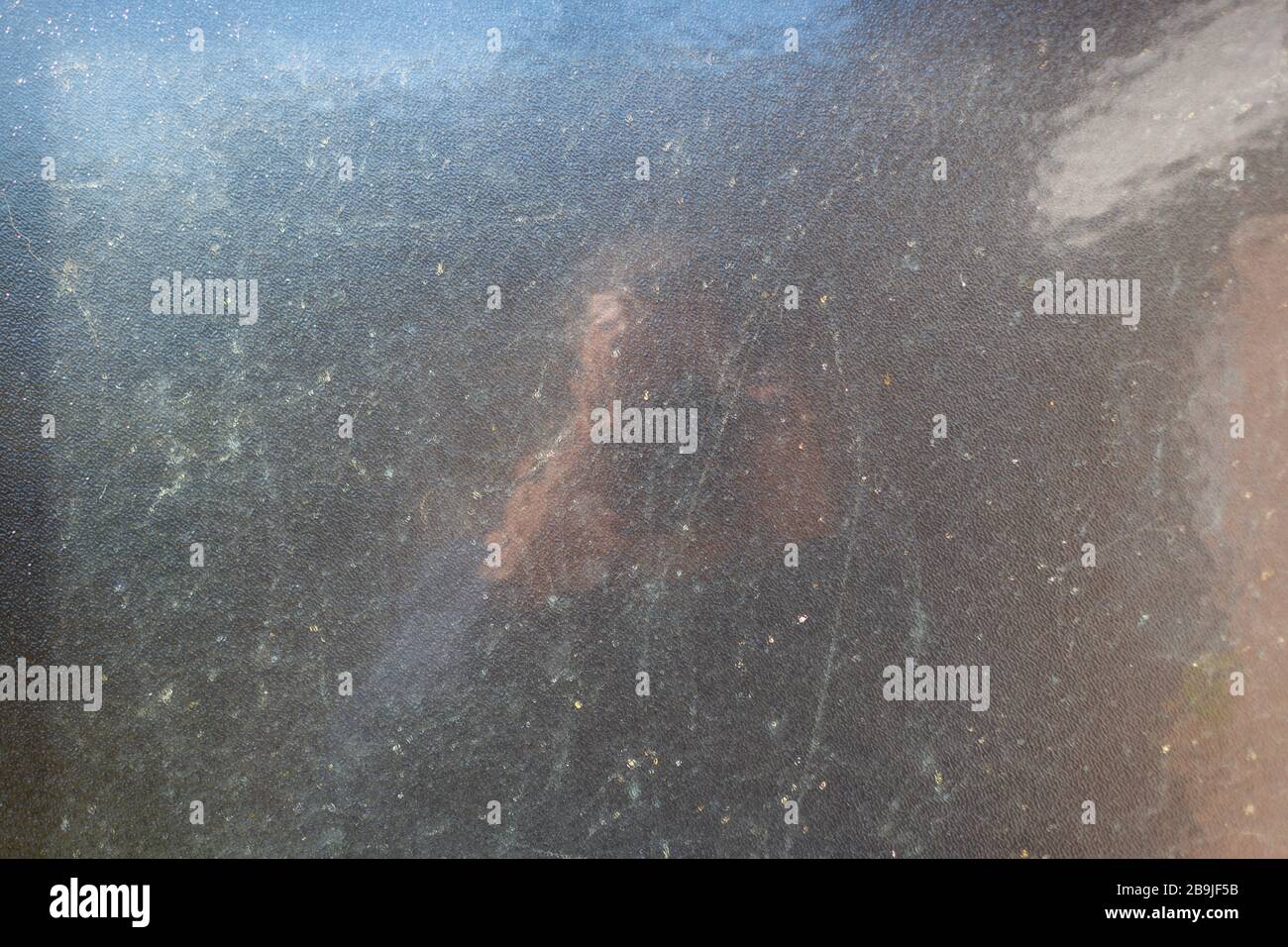 plain glass background illuminated by sunlight and with a slight ...