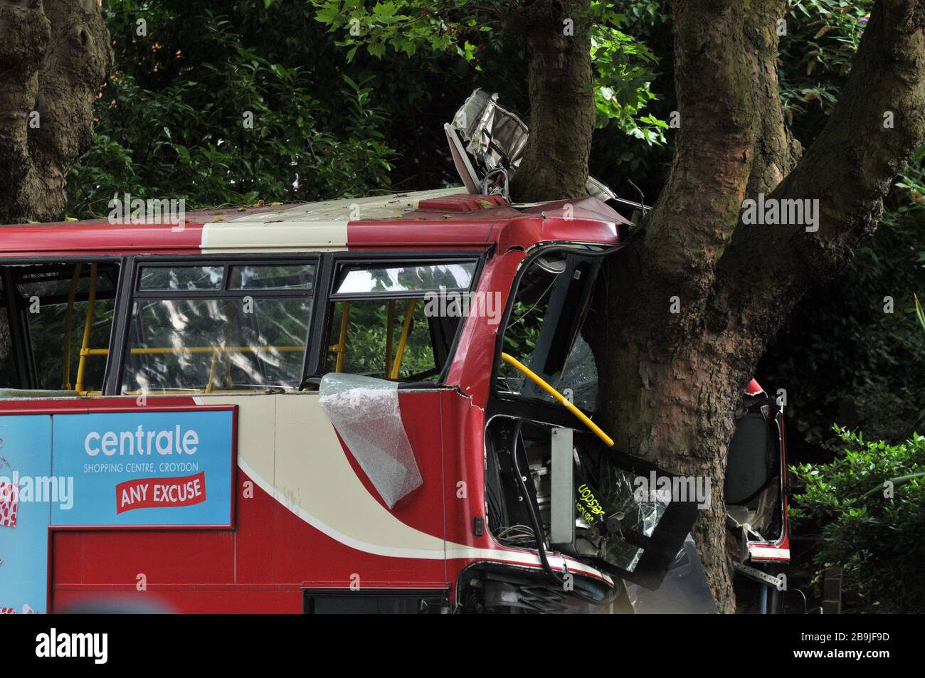 An iconic red double decker London bus crashed into a tree in Croydon ...