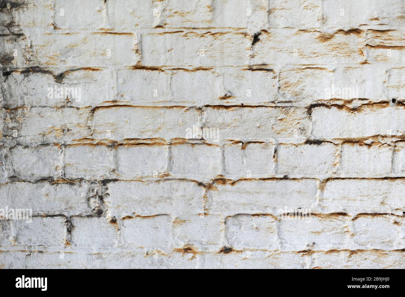 A white brick wall covered in dirty pollution gives interesting texture ...