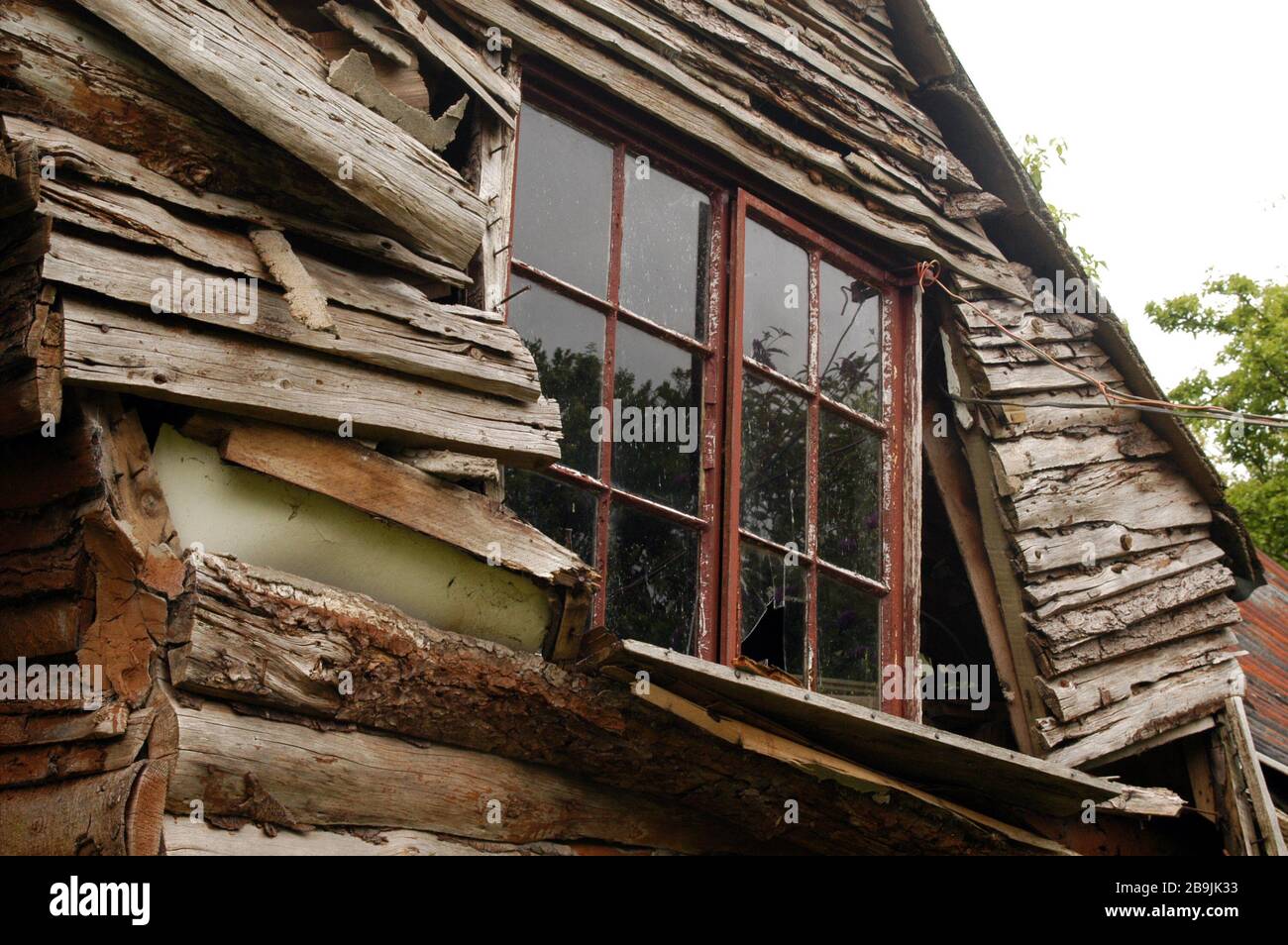 Broken walls of old dilapidated wooden house that's falling down Stock ...