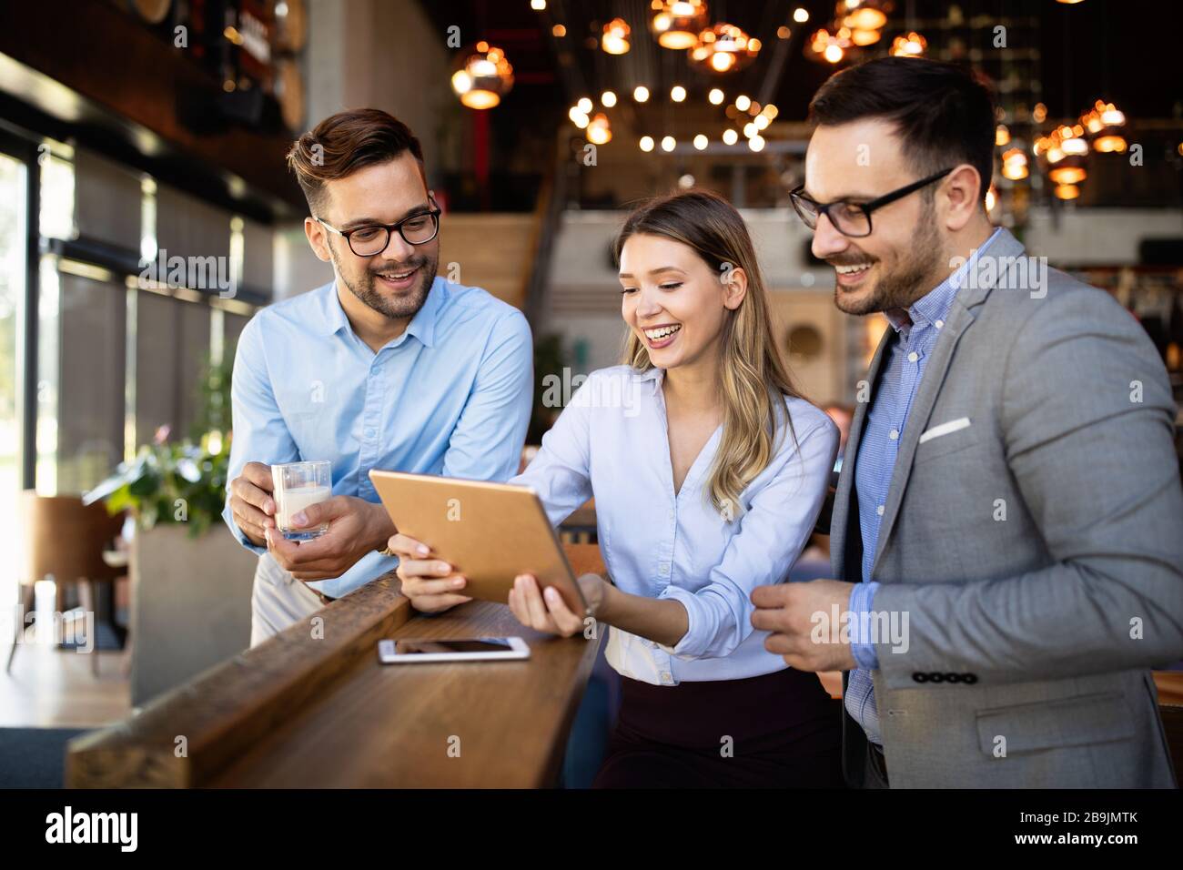 Business people having fun and chatting at workplace office Stock Photo ...