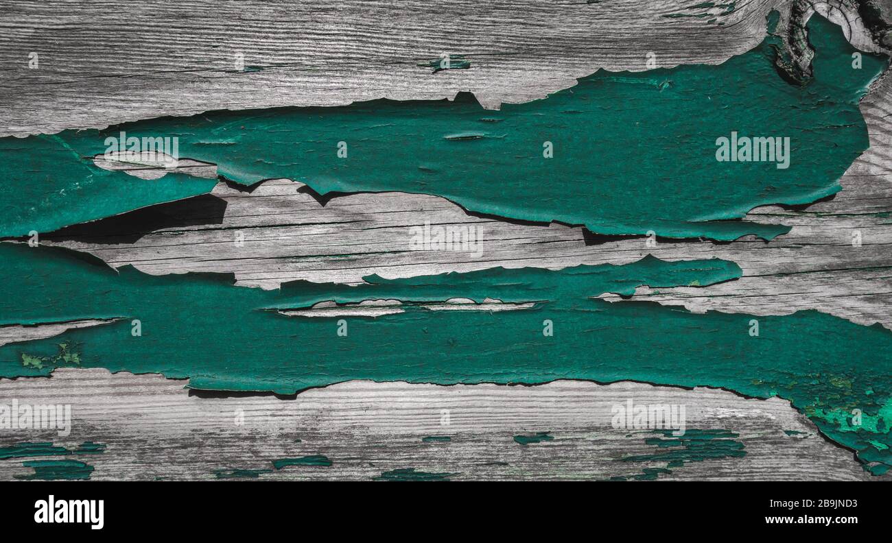 Wood panel with flaking off green colour Stock Photo - Alamy