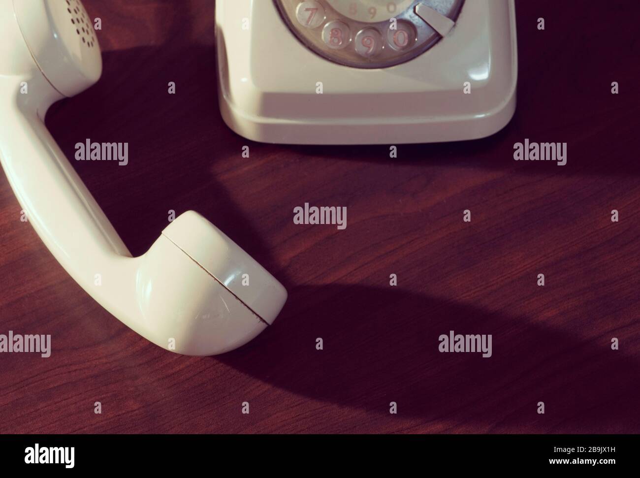 landline telephone with its receiver off of the hook Stock Photo - Alamy