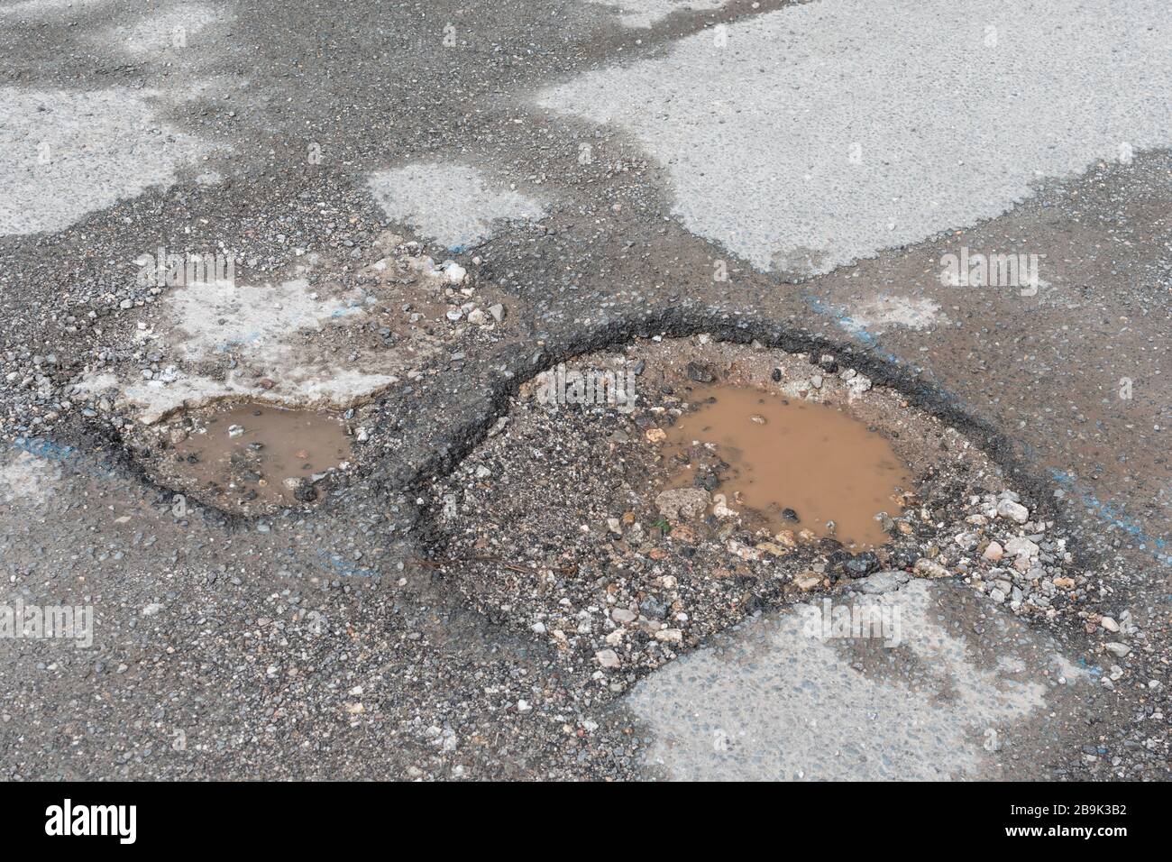 Pothole in road tarmac. For road potholes, pothole breakdowns on the ...