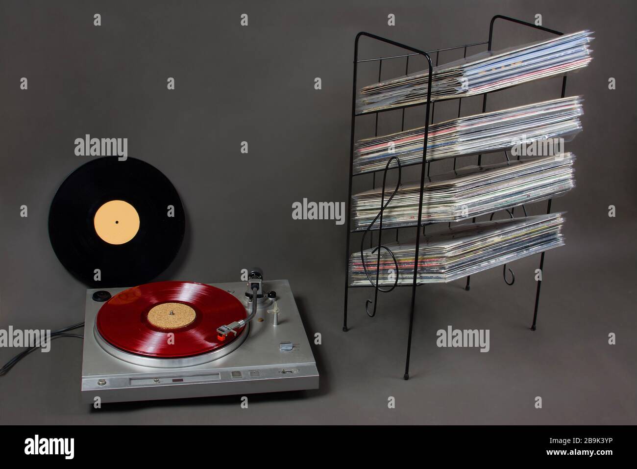 red vinyl record on turntable, stand with vinyl records Stock Photo - Alamy