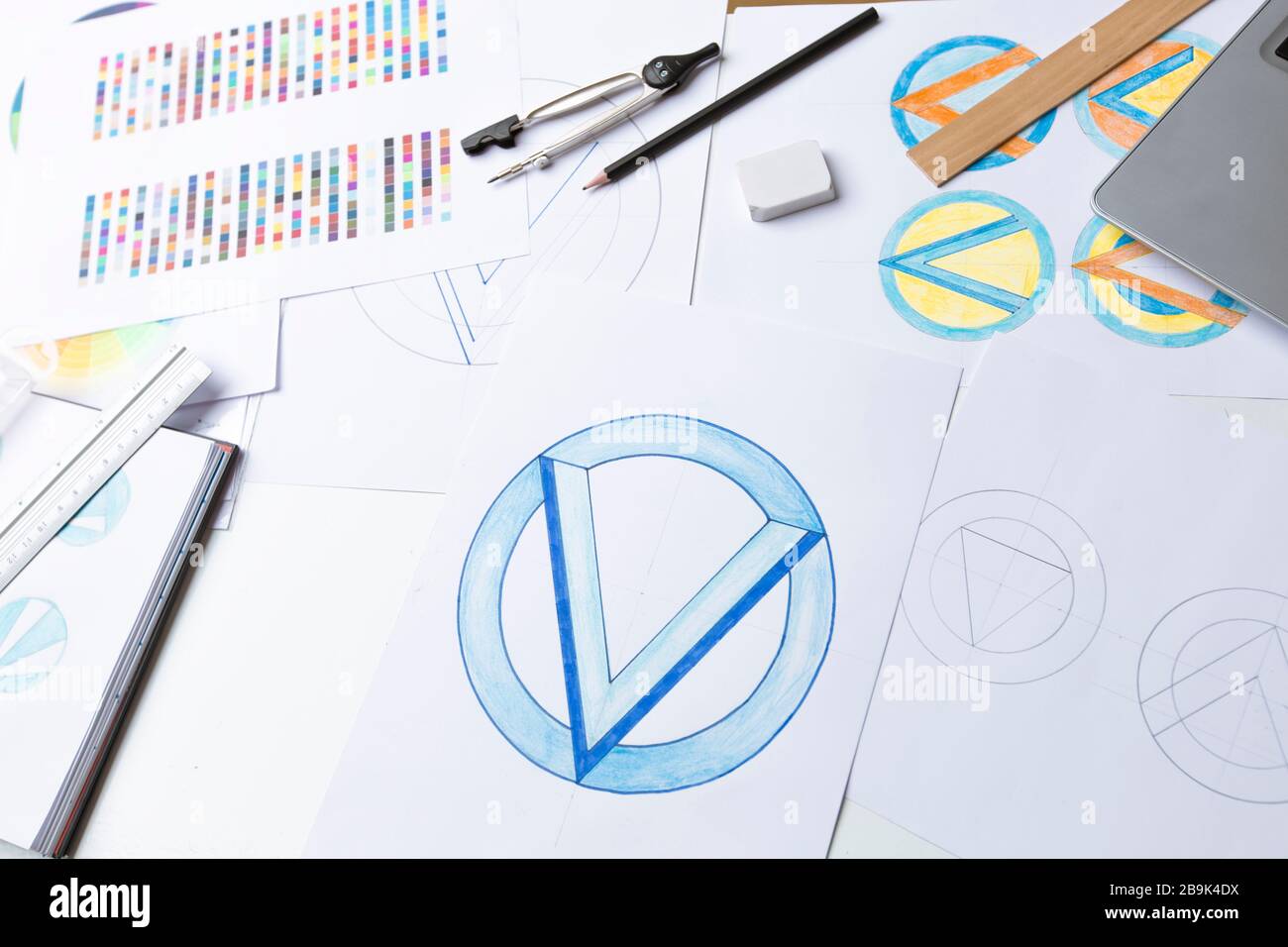 Designer draws a sketch of a brand logo Stock Photo - Alamy