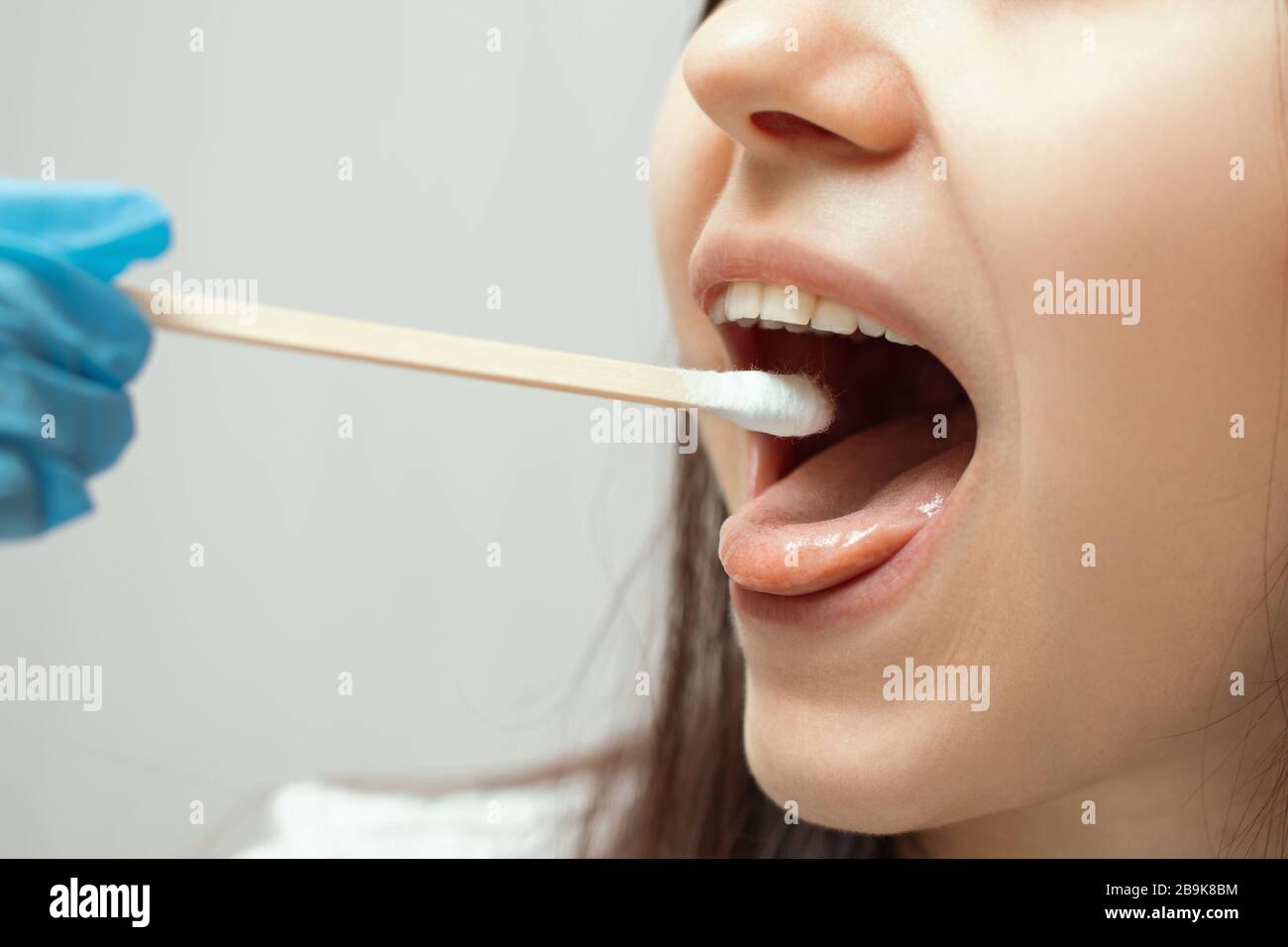 Woman throat swab hi-res stock photography and images - Alamy