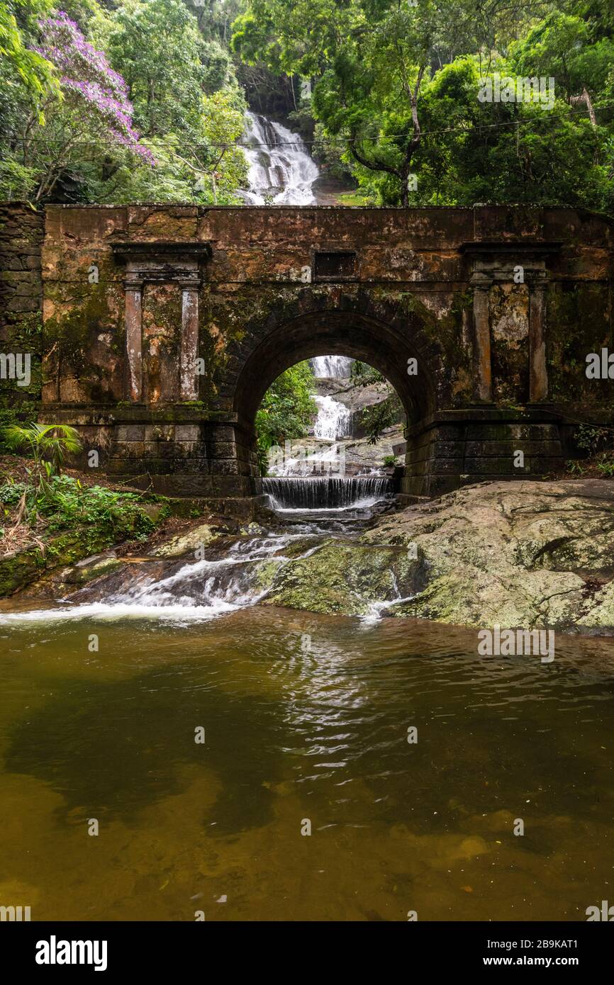 Old historic rocky bridge over Atlantic Rainforest river in Tijuca ...