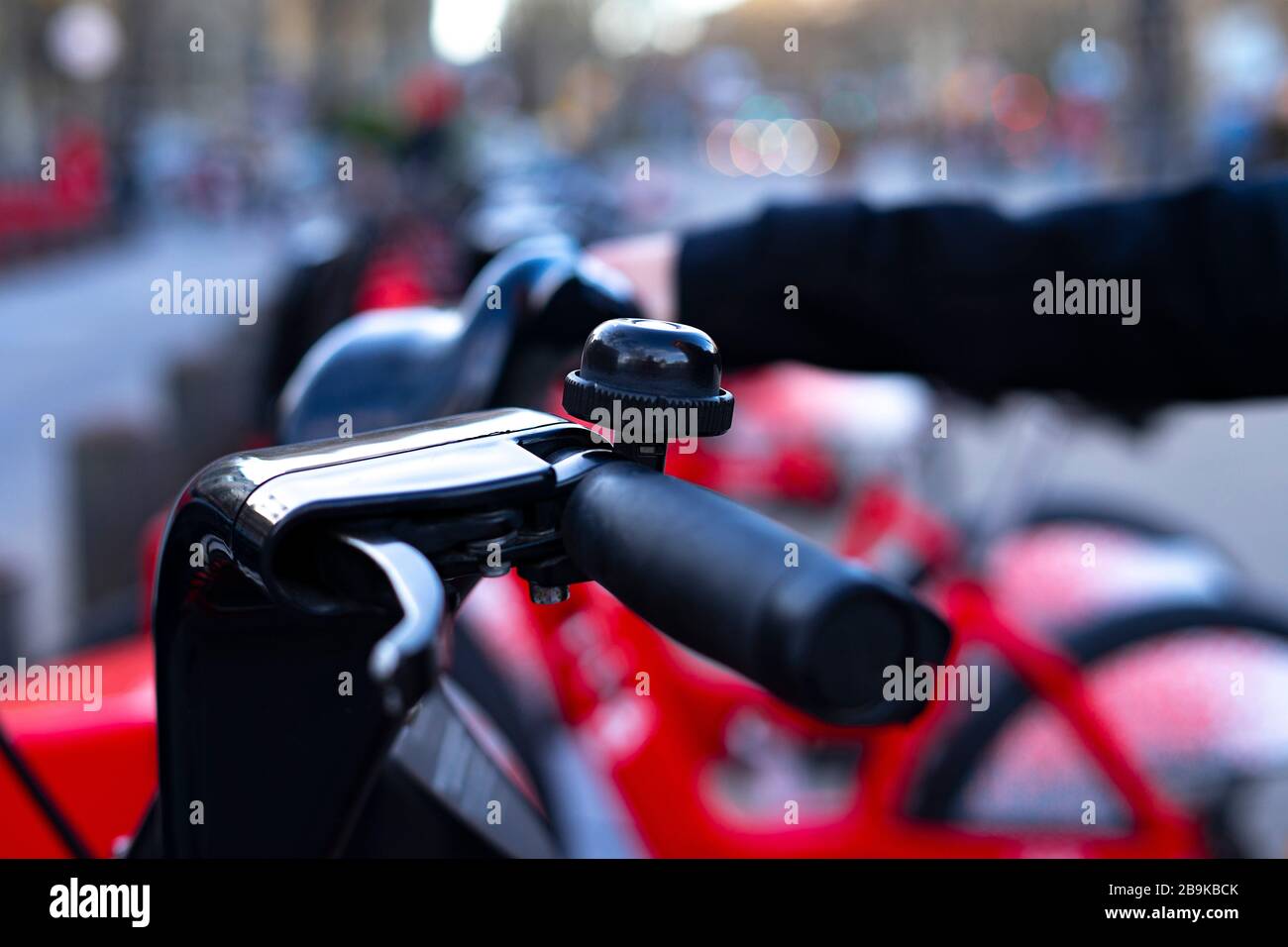 Handlebars of a red bike. Bicycle handlebar concept Stock Photo - Alamy