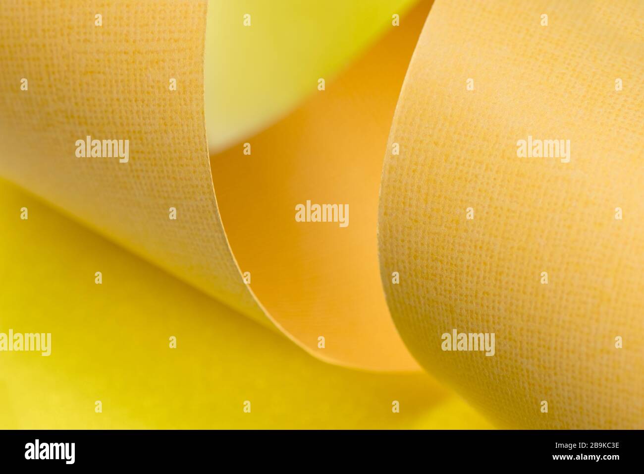 Yellow curve paper design background Stock Photo - Alamy
