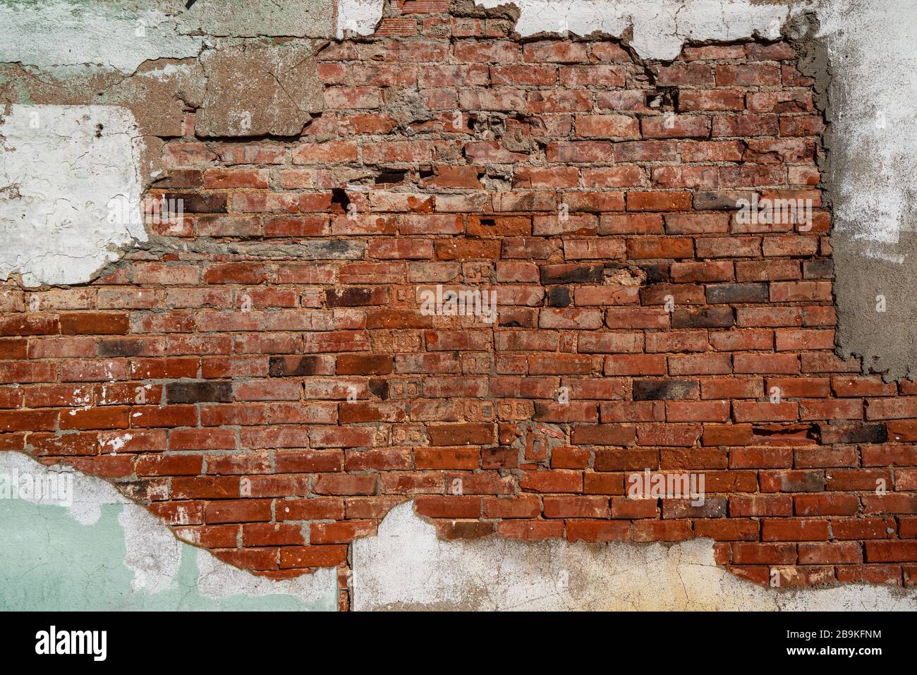 Damaged brick wall Stock Photo - Alamy