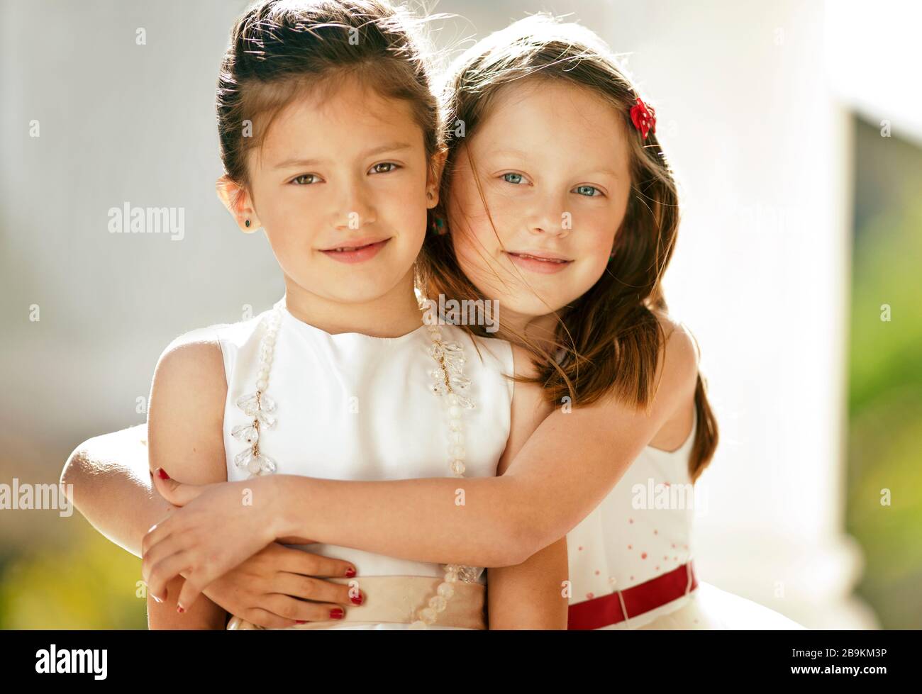 Portrait of two young girls embracing Stock Photo - Alamy Portrait of two young girls embracing Stock Photo - Alamy