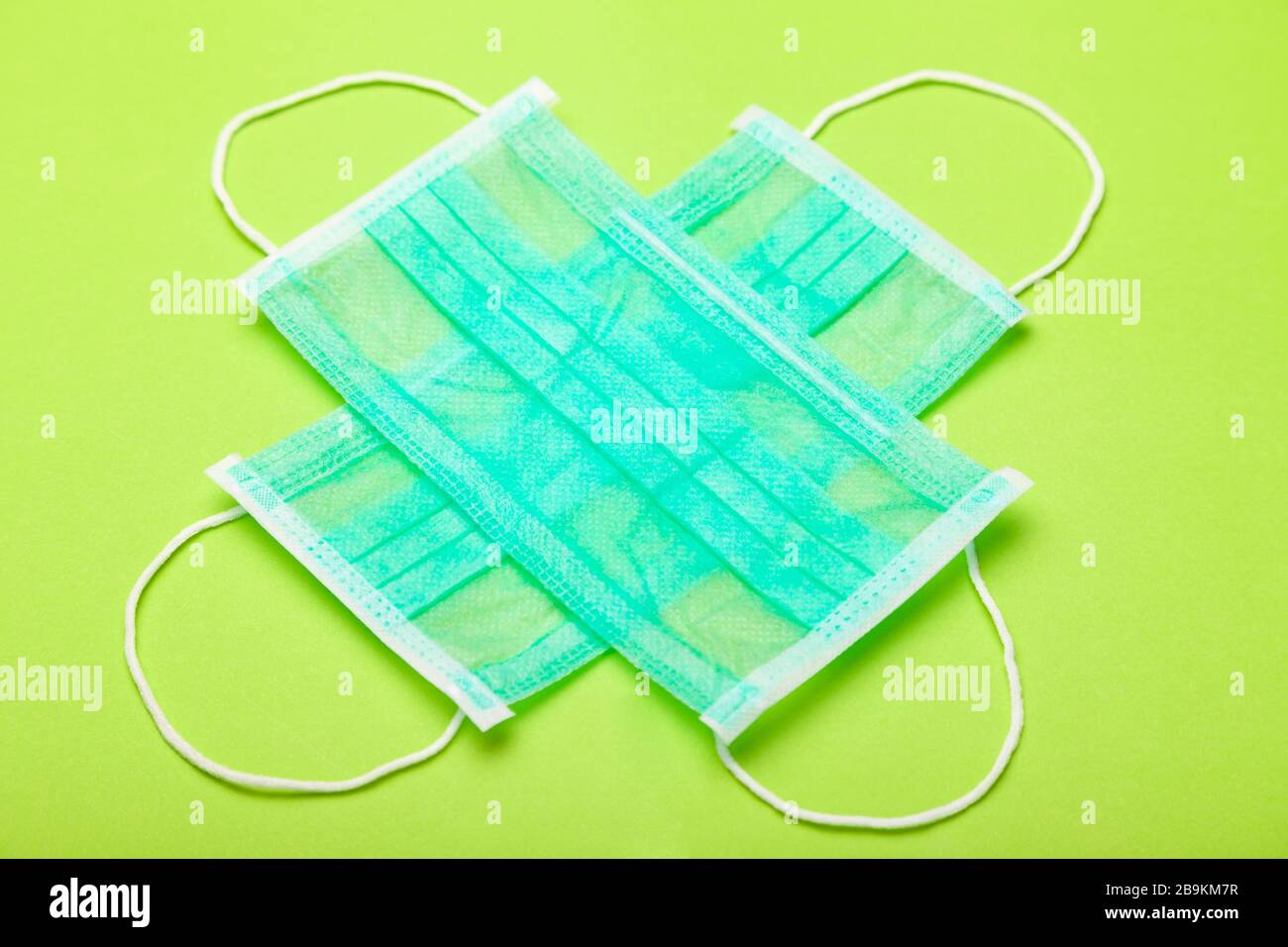Face Mask from above on a green Background Stock Photo - Alamy