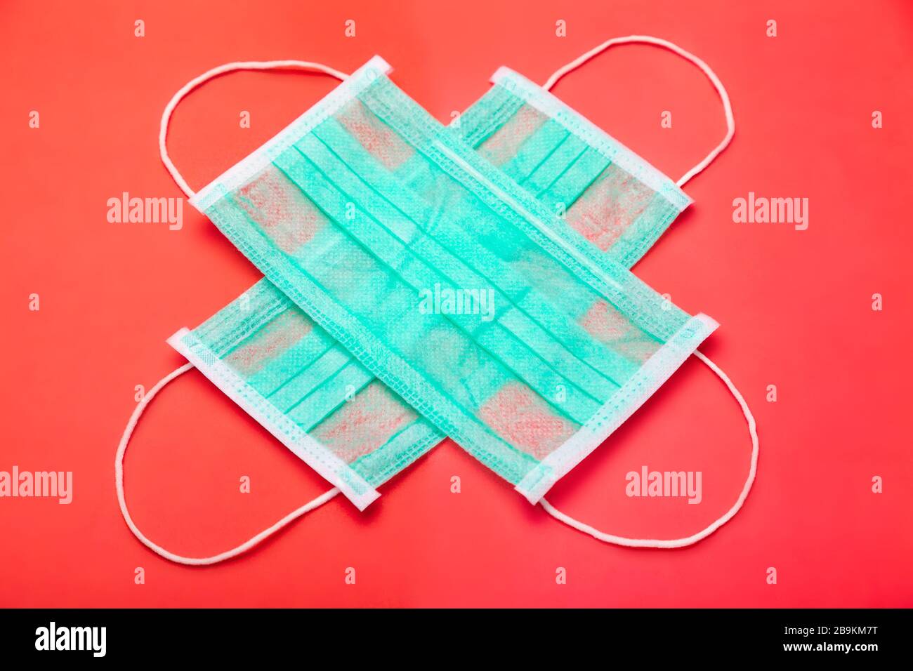 Face Mask from above on a red Background Stock Photo - Alamy