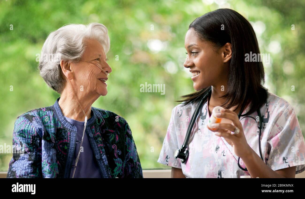 Nurse explaining take pills senior hi-res stock photography and images ...