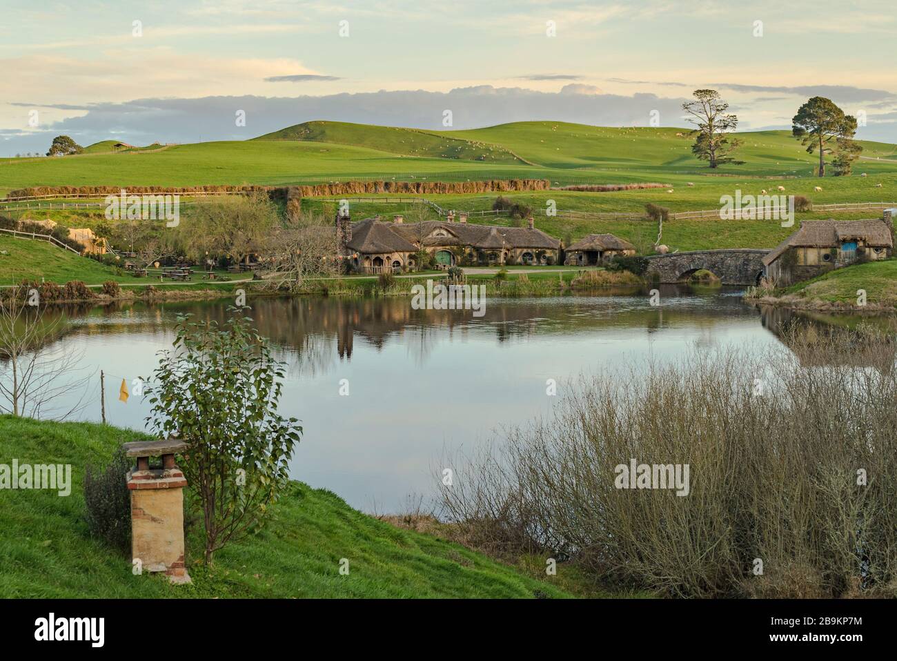 View across the lake to the Green Dragon Inn at the Hobbiton Movie Set ...