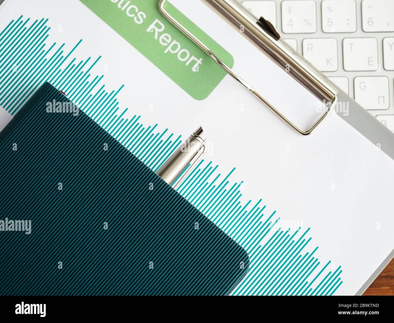 Chart financial report folder, notebook with pen Stock Photo - Alamy