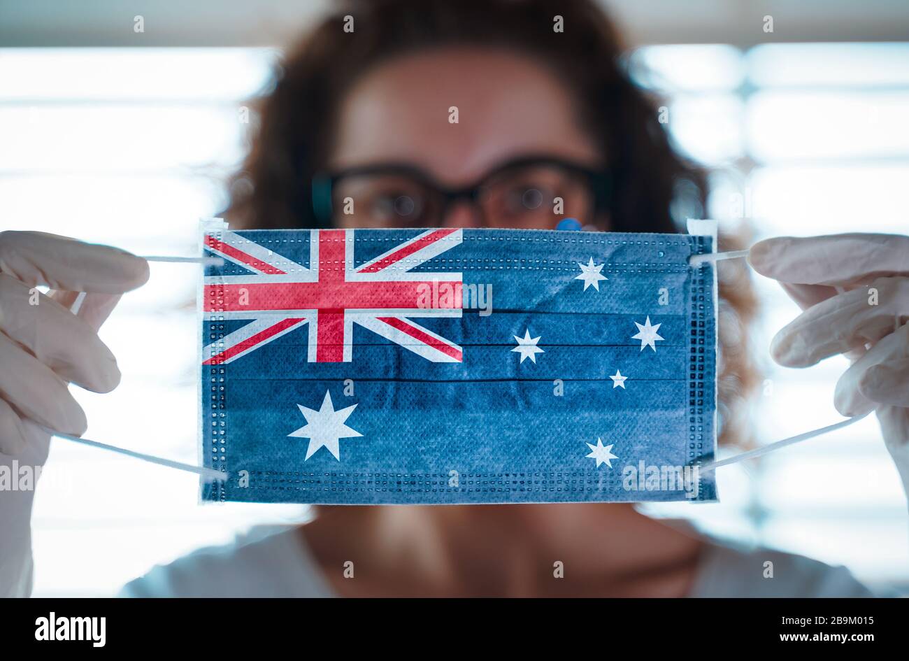 Pandemic Coronavirus. Close up of young woman with surgical mask with ...