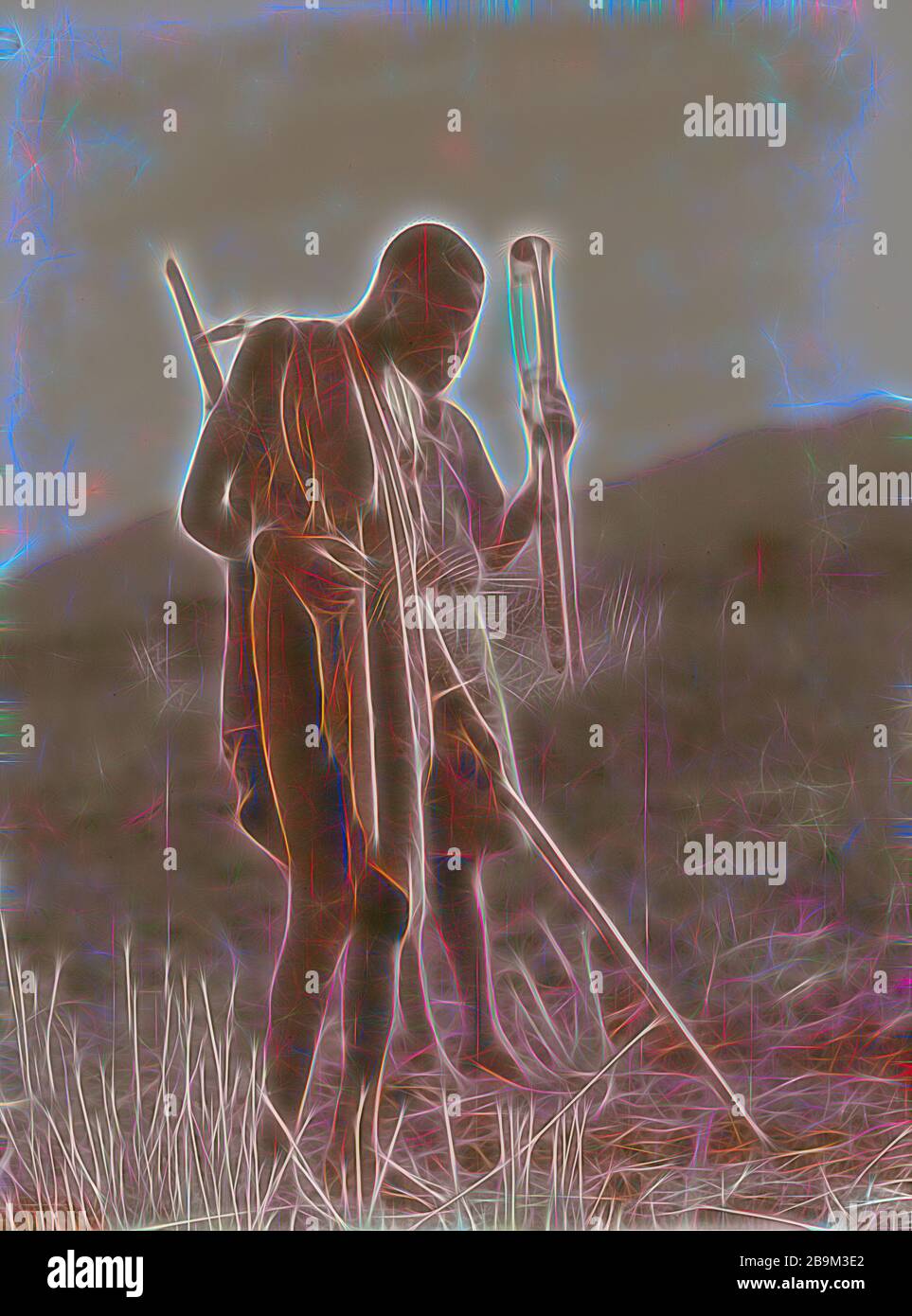 Kenya Colony. Namanga, southern game reserve. Native tracker studying ...