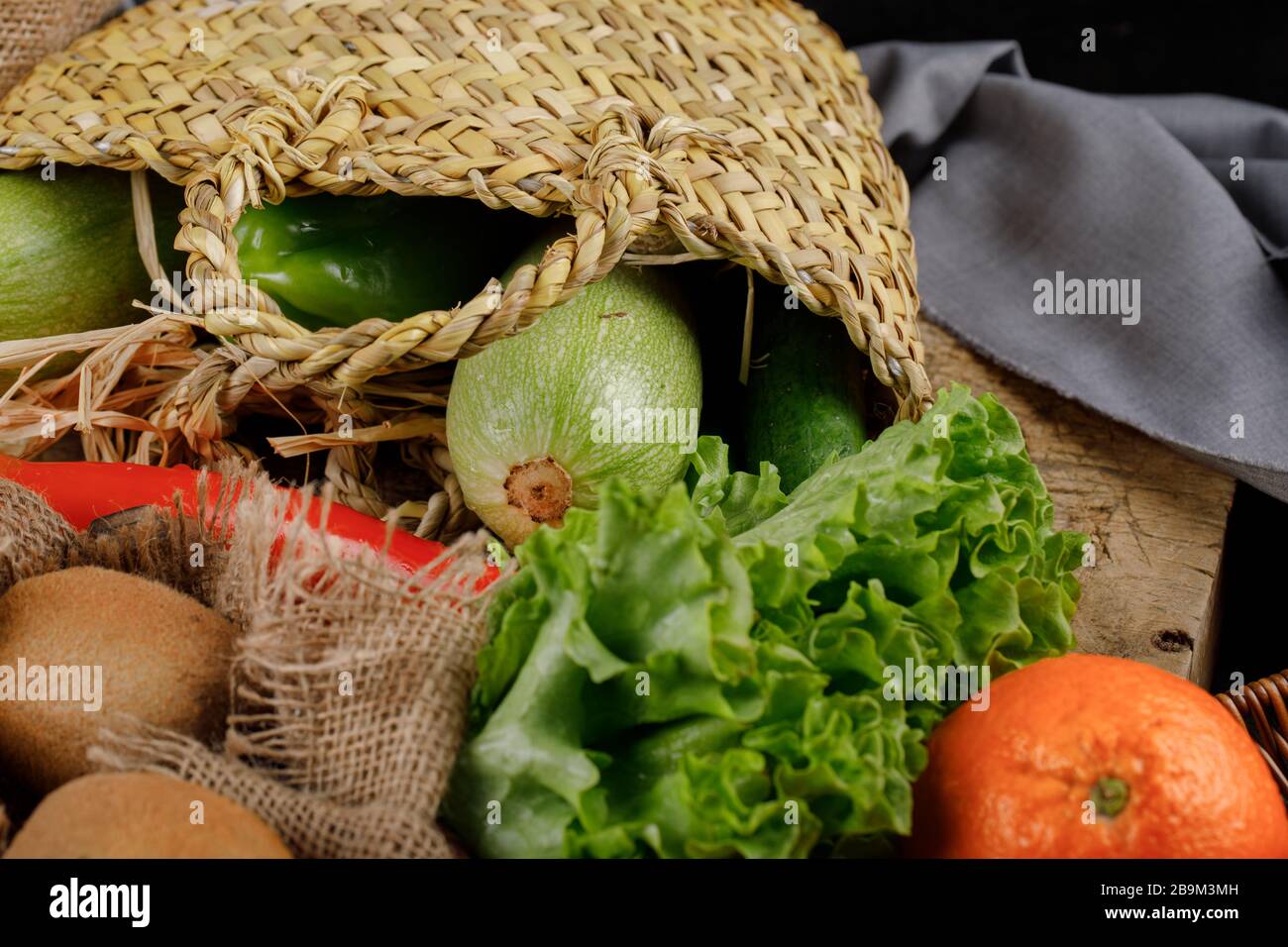 Vegetables and fruits in a rustic basket Stock Photo - Alamy