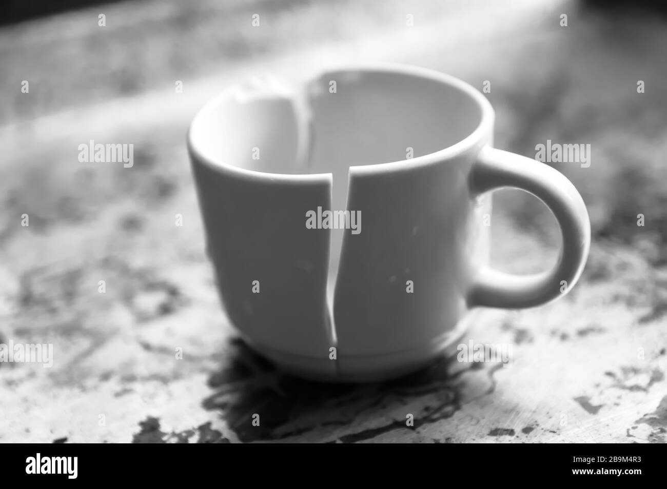 A cup of coffee that stands up despite being completely broken is on a ...