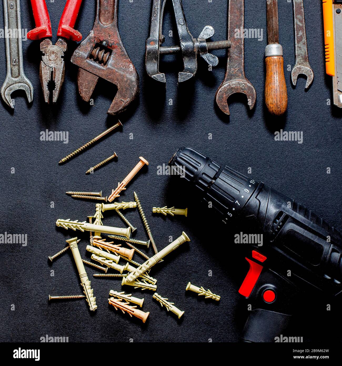 Construction worker tools on a dark background top view Stock Photo - Alamy