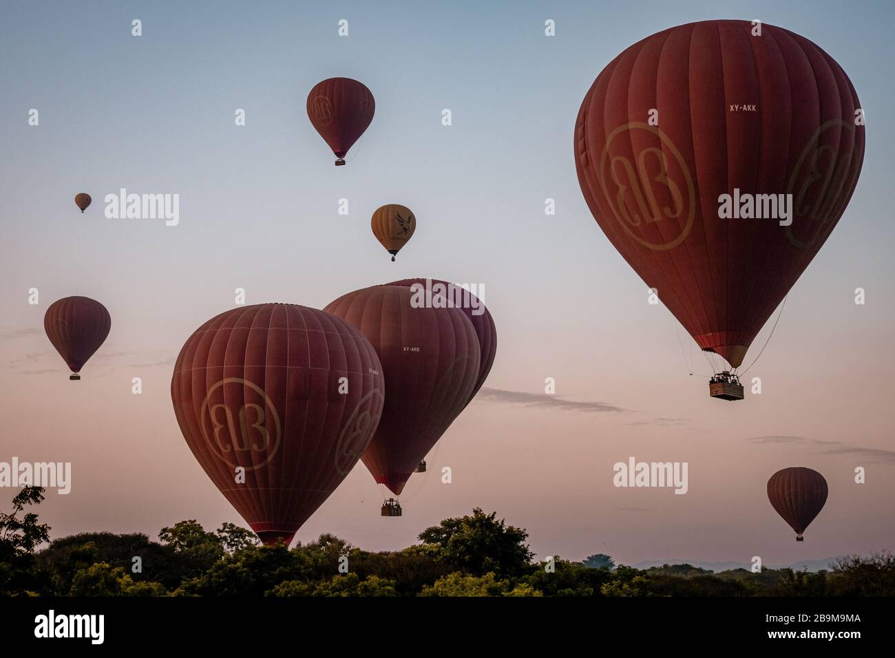 Bagan Myanmar, hot air balloon during Sunrise above temples and pagodas ...