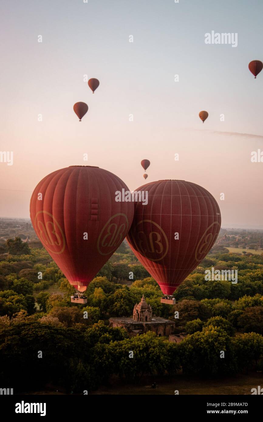 Bagan Myanmar, hot air balloon during Sunrise above temples and pagodas ...