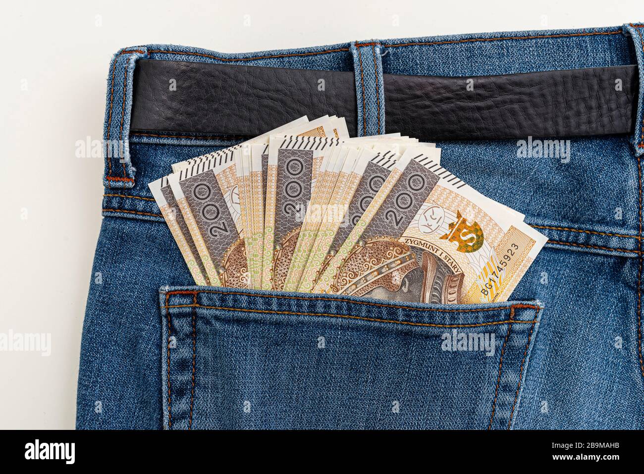 A lot of Polish banknotes with a nominal value of 200 PLN inserted into ...