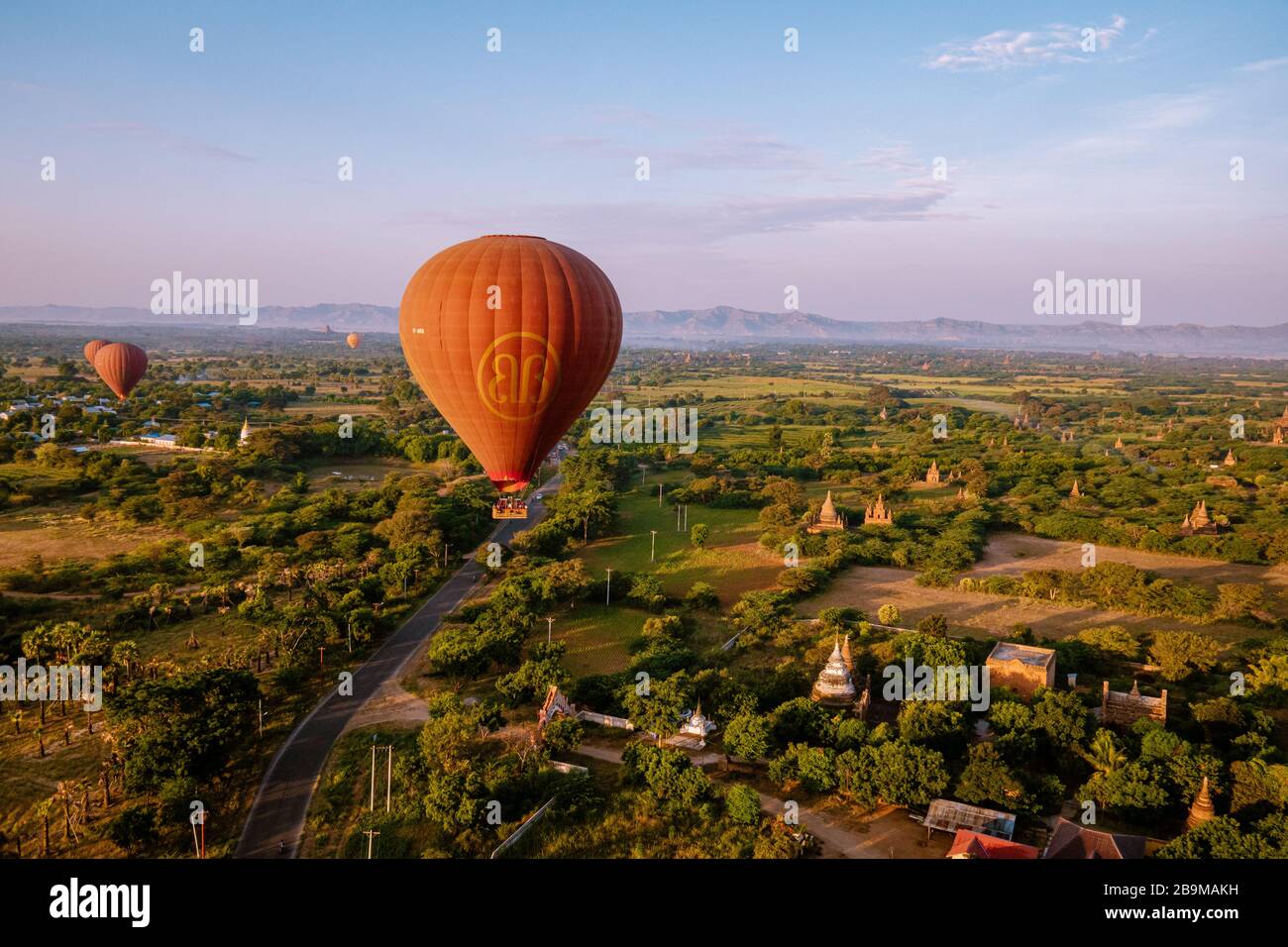 Bagan Myanmar, hot air balloon during Sunrise above temples and pagodas ...