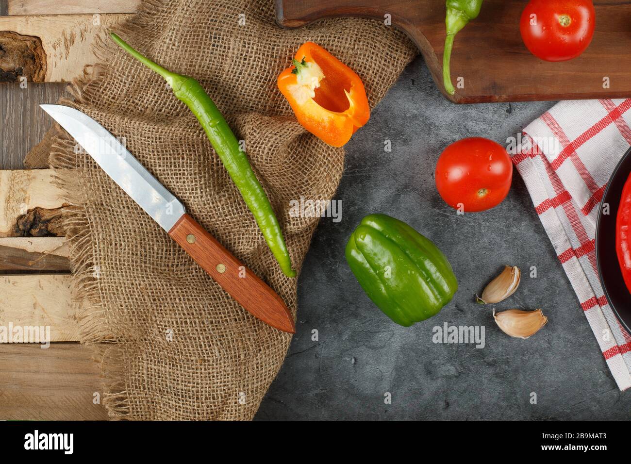 Mixed selection of chilies on a grey stone table. Top view Stock Photo ...