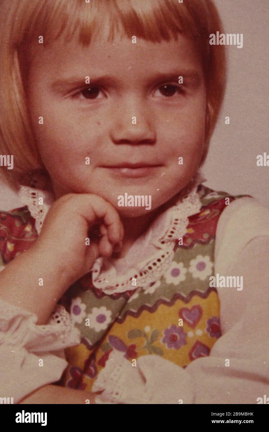 Formal grade school portrait of a beautiful young caucasian girl with ...