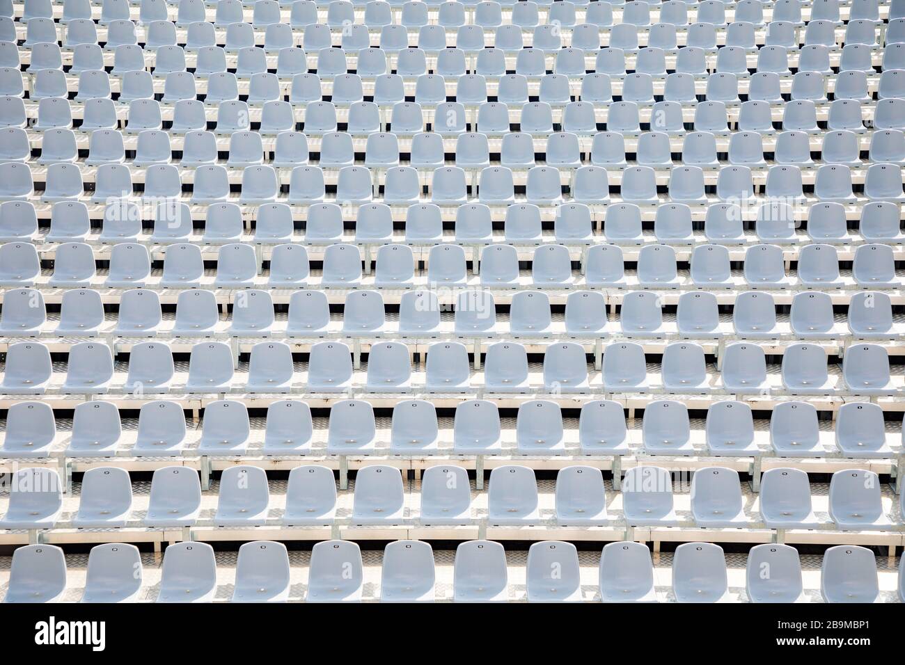 Empty white plastic seats in a stadium as a urban background or texture ...