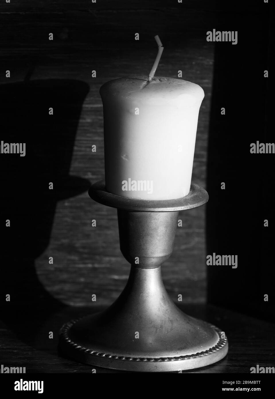 Black and white candle and its shadow Stock Photo - Alamy