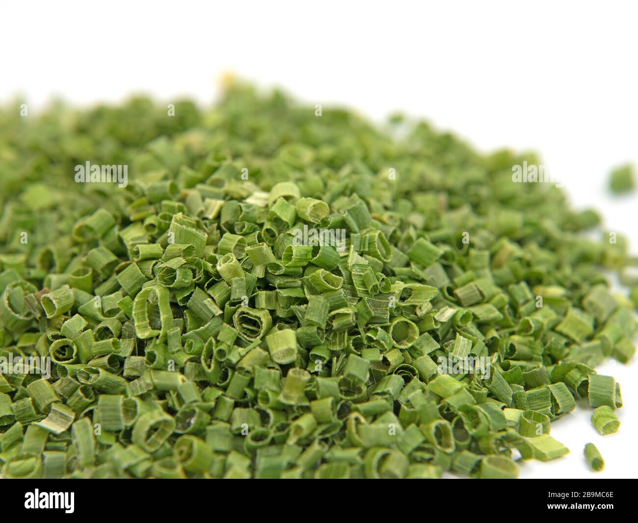 Dried chives against white background Stock Photo - Alamy