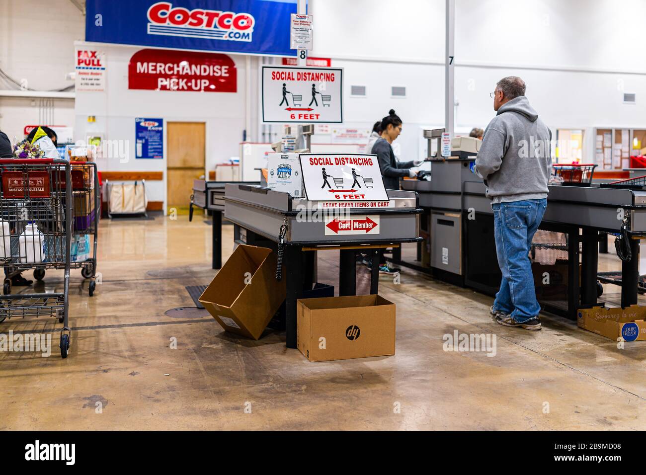 Sterling, USA - March 23, 2020: People customers and workers at cash ...